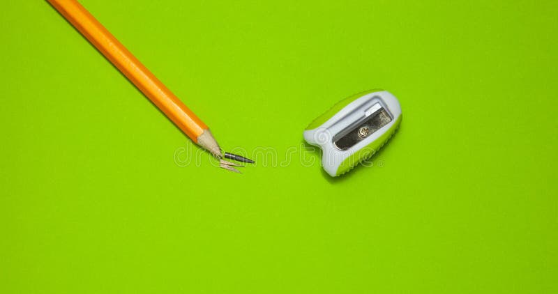 Broken Pencil and Sharpener on Green Background, Top View Stock Image ...