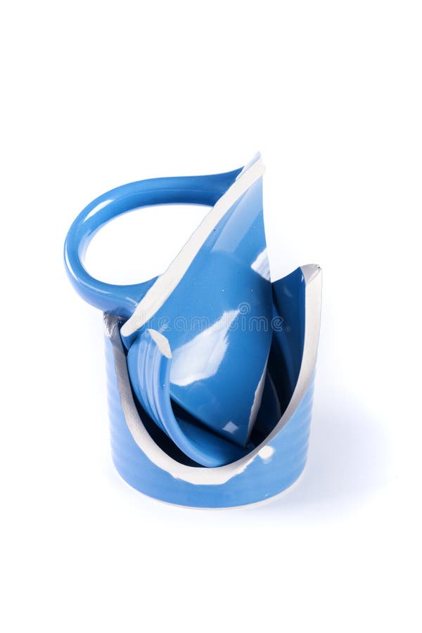 Broken Pieces of Blue Ceramic Mug Stacked Inside the Main Shattered ...