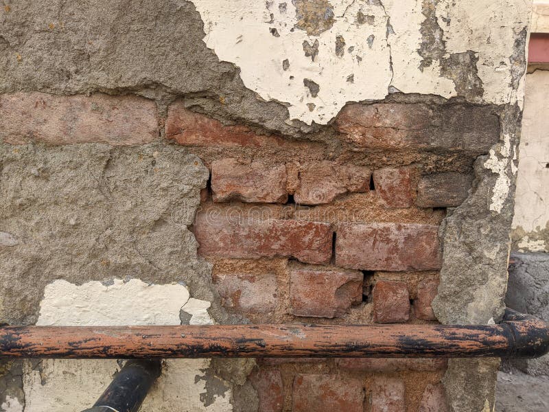 Broken Plaster from the Unmaintained Wall with a Pipe Line Stock Image ...