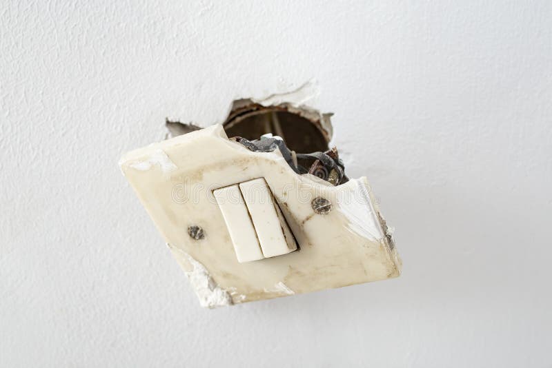 Broken Plastic Light Switch Ripped from a Whjte Wall, Abstract ...