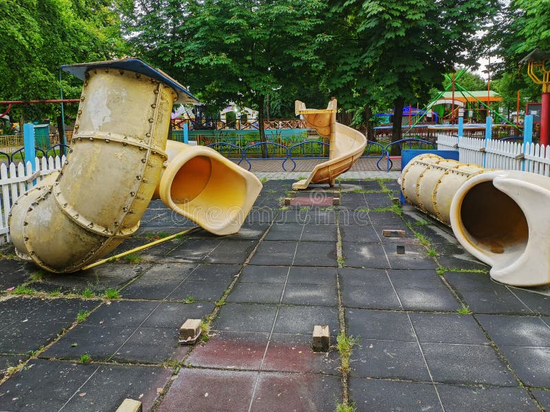Broken Playground with Slides in an Amusement Park on a Summer Day ...