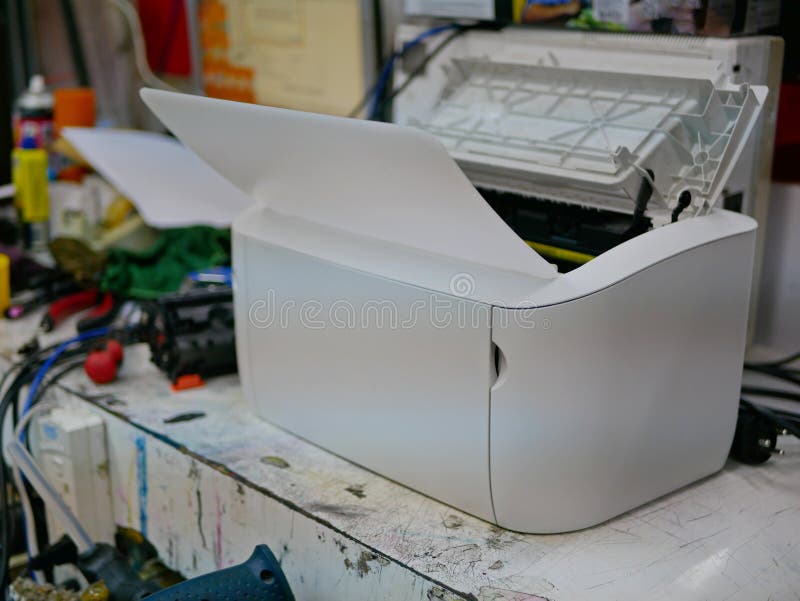 A Broken Printer Was Placed on a Dirty Table in a Repair Shop about To ...