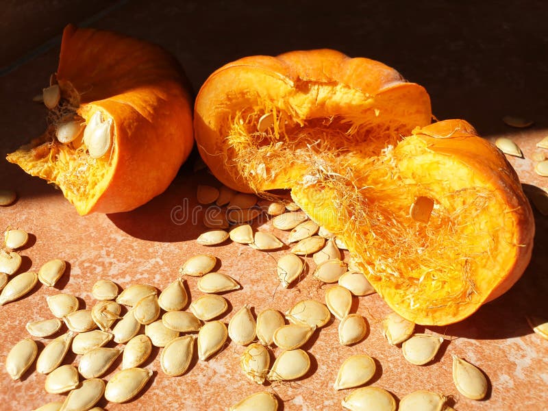 Broken pumpkin in half stock photo. Image of fall, colorful - 179890568