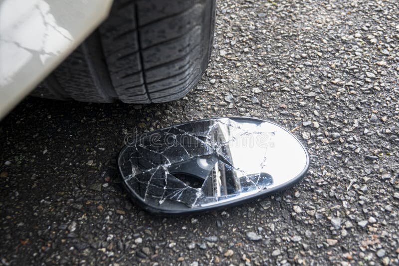 Broken Rear View Mirror Under Car Wheel. Stock Photo - Image of ground ...