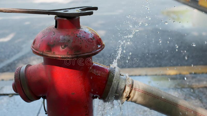 Broken Red Fire Hydrant that is Squirting Water Stock Footage - Video ...