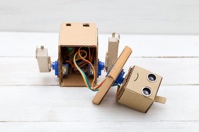 Broken Robot Lying on the White Table, Spare Parts Stock Photo - Image ...