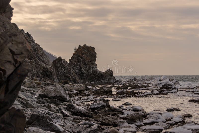 Icy Sharp Rocks in a Cold Sea Stock Photo - Image of rocks, cold: 176420396