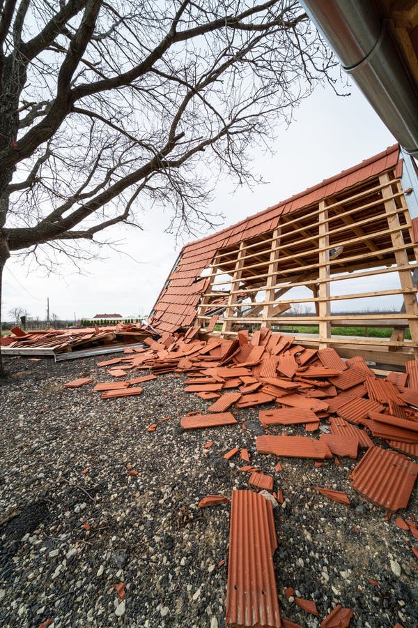Broken roof after a storm stock image. Image of earthquakes - 185735635