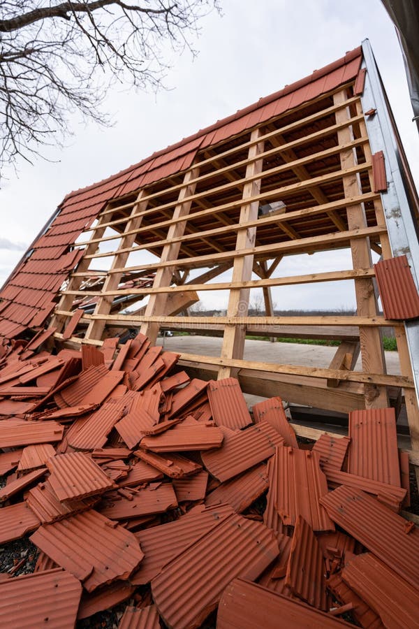 Broken roof after a storm stock photo. Image of crack - 185735898