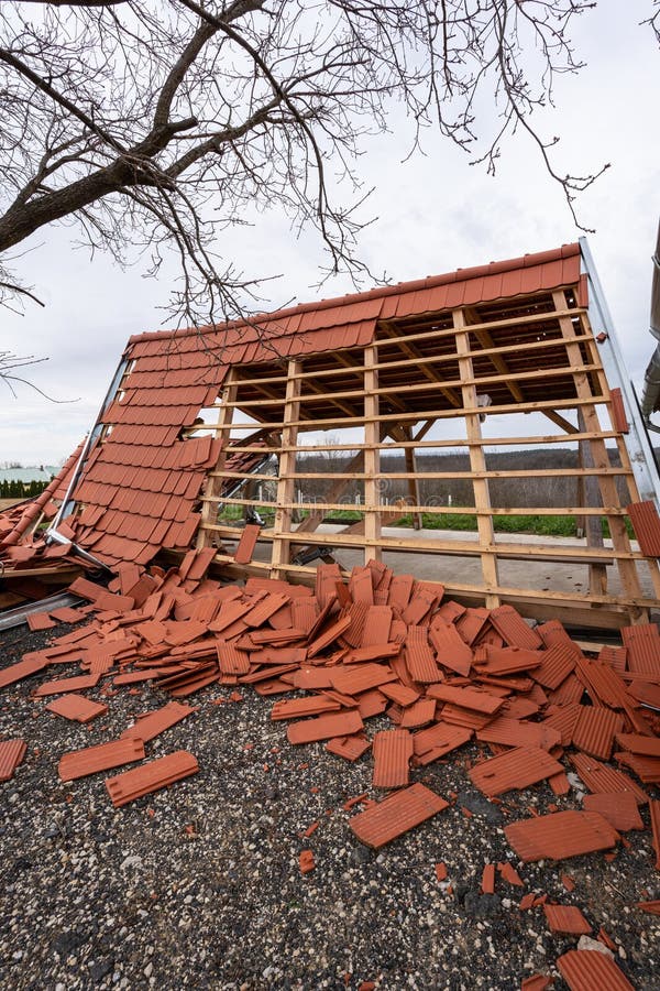 Broken roof after a storm stock image. Image of danger - 211739329