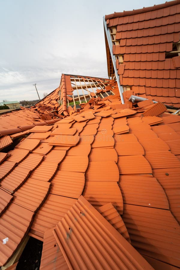 Broken roof after a storm stock image. Image of climate - 211739147