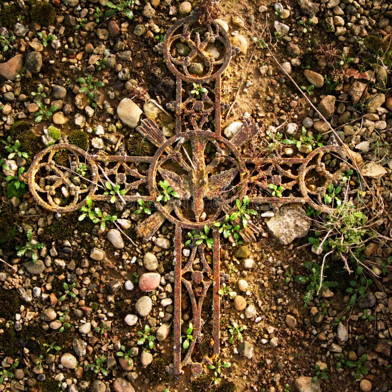 Broken and Rusty Iron Rustic Crucifix on Old Mossy Tombstone. Abandoned ...