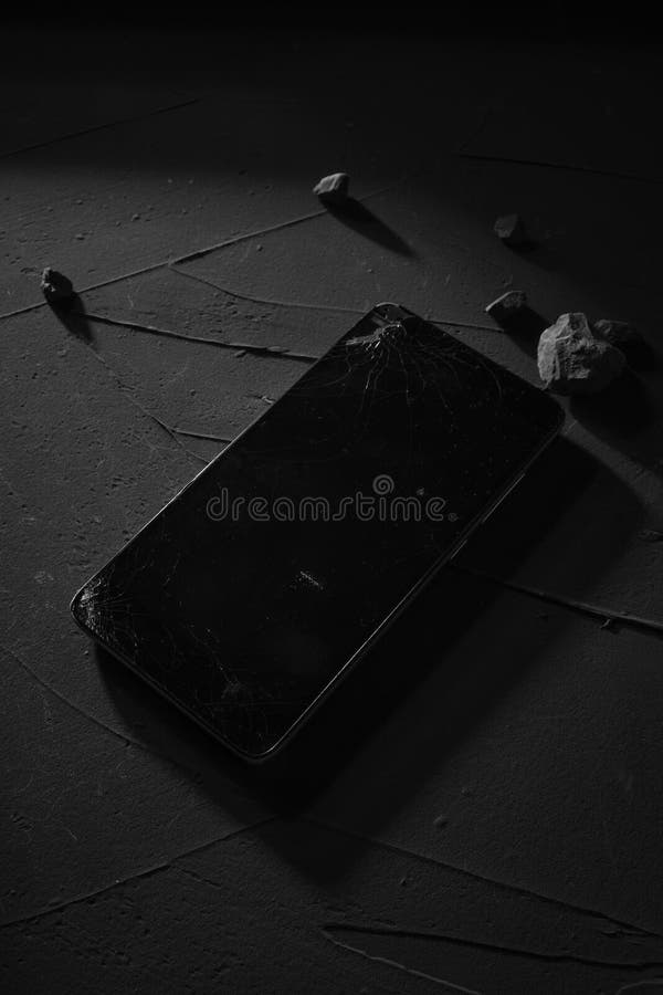 Broken Screen Phone on Concrete Background with Hard Light, Shadows ...