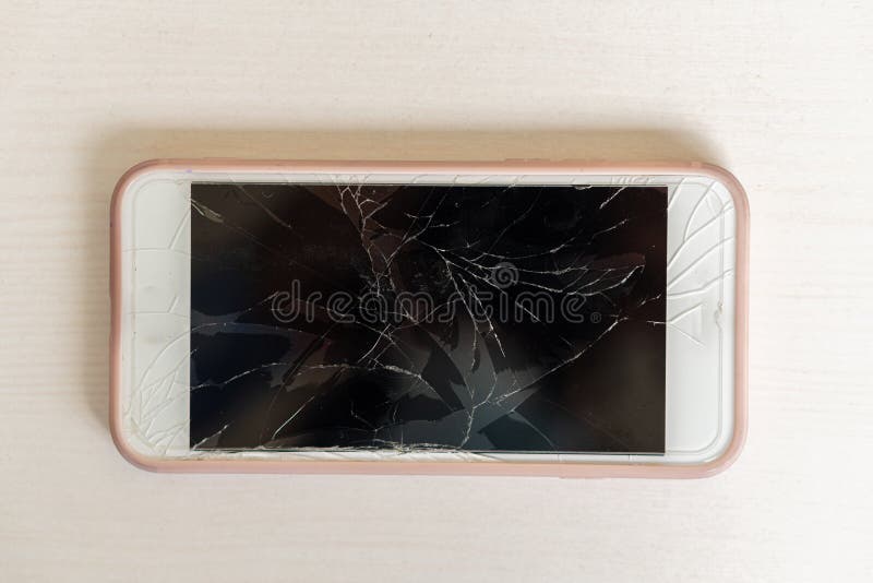 Broken Screen Smartphone Laying on a Separate White Desk, Backside ...
