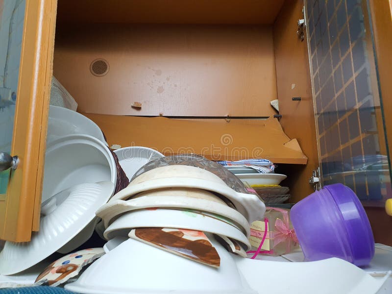 The Broken Shelf in the Cabinet Caused the Plates and Bowls To Fall and ...