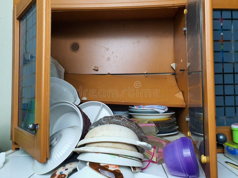 The Broken Shelf in the Cabinet Caused the Plates and Bowls To Fall and ...