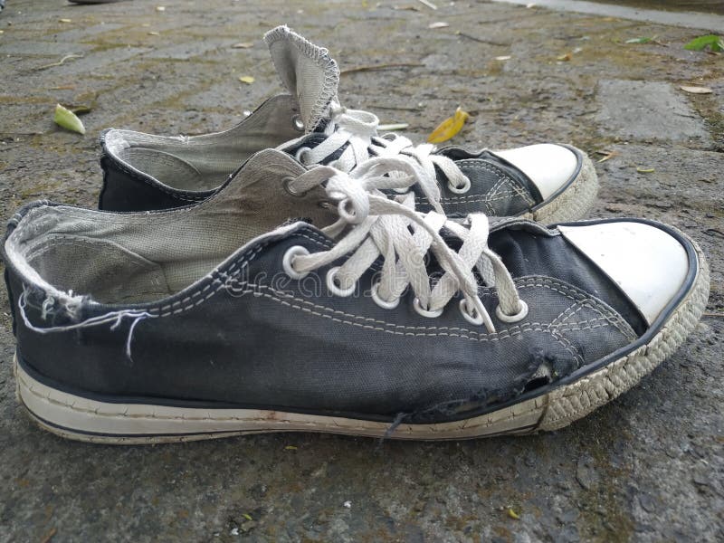 Broken shoes with a hole stock image. Image of converse - 281424745