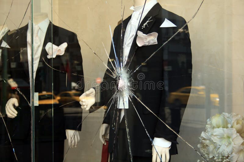 Broken Shop Window Pane that Looks Like a Bullet Hole with Sunlight ...