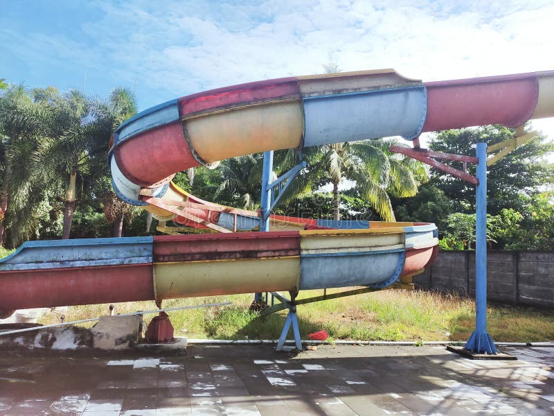 Broken Slide Game in Swimming Pool. the Color is Faded. Full of Rust ...