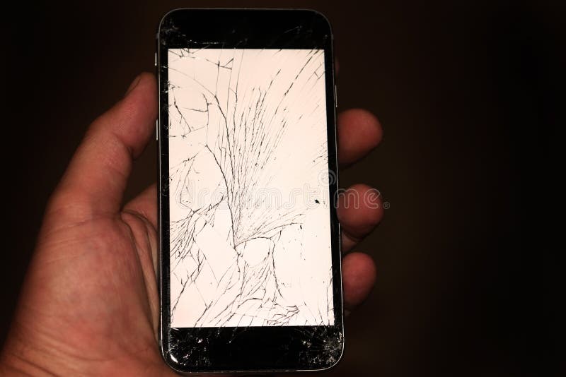 Broken Smartphone with Glowing Screen in Hand. Broken Phone Screen ...