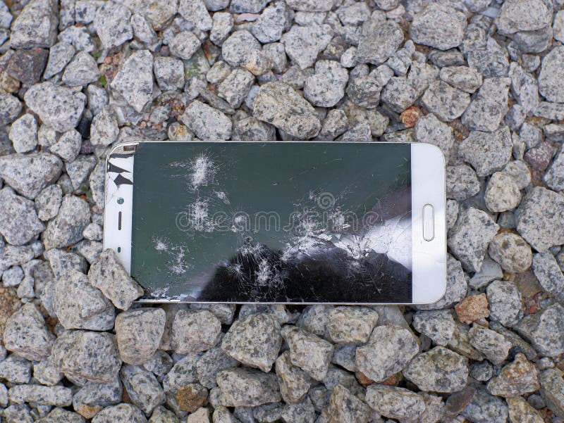 Broken Smartphone Screen on a Pile of Pebbles,cracked Smartphone Screen ...