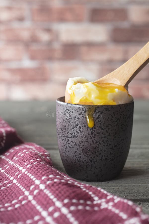 Broken Soft Boiled Egg in a Cup on Rustic Table Stock Photo - Image of ...