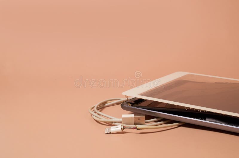 A Broken Tablet with a Swollen Battery and a Dirty Screen and a Bare ...