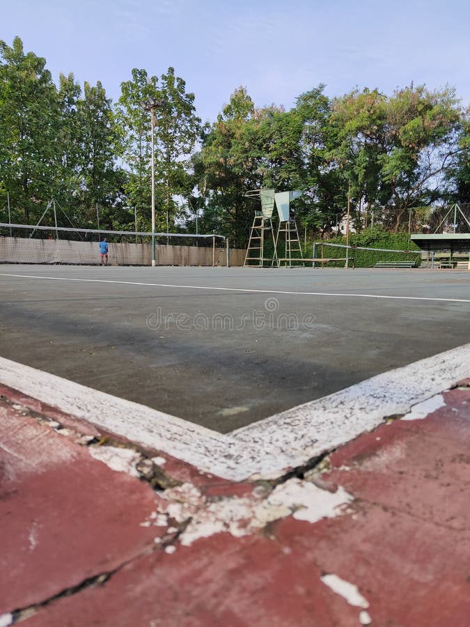 Broken tennis court stock image. Image of ball, tennis - 199720375