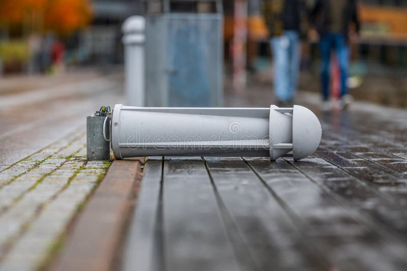 Broken and Toppled Over Street Lamp by a Walking Path.. Stock Photo ...