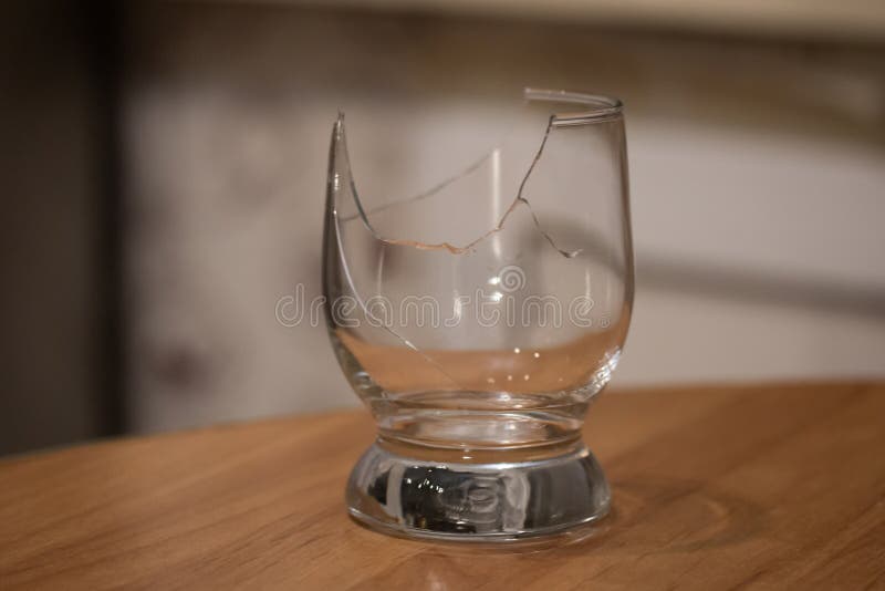 Broken Transparent Drinking Glass on the Table Stock Image - Image of ...