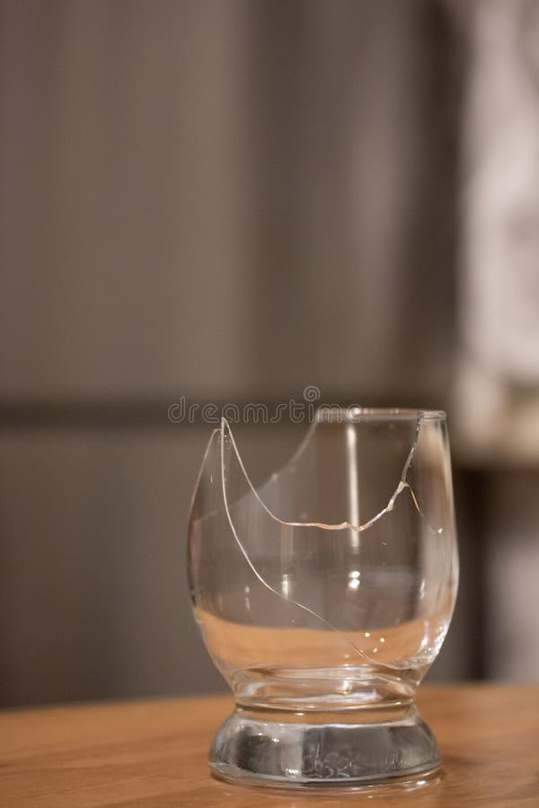 Broken Transparent Drinking Glass on the Table Stock Image - Image of ...