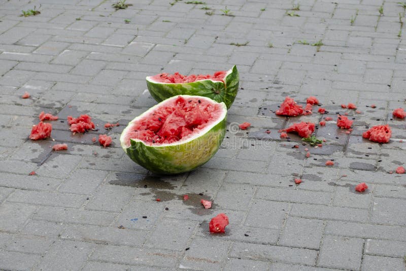 Watermelon Broken in Half Lying on the Ground Stock Photo - Image of ...