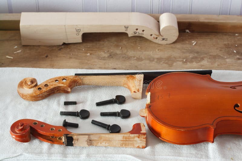 Old Shabby Broken Yellow Violin For Restoration Hanging On The Wall ...