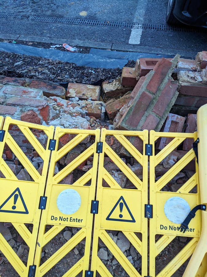 Broken Wall in a Carpark Been Hit by a Car with Warning Barrier Around ...