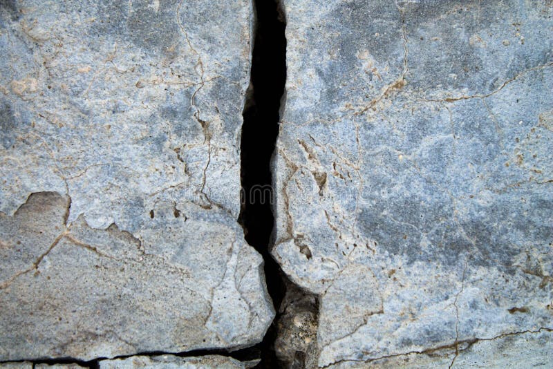 Broken Wall with Cracks. the Gray Plaster Fell Off the Wall Stock Photo ...