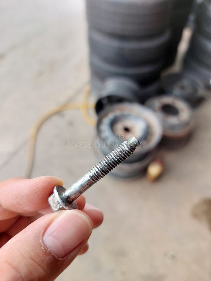 Broken Wheel Attachment Screw. in Hand Stock Photo - Image of ...