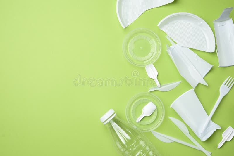Broken White Plastic Tableware, Transparent Bottle on Green Background ...