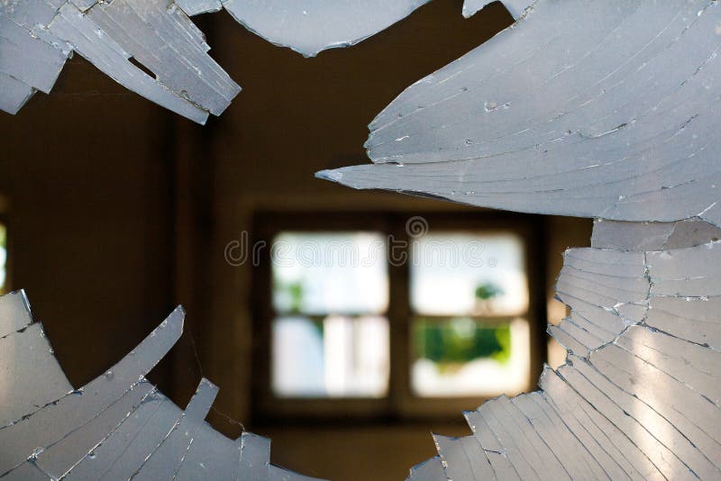 Broken Window Glass Looking Inside a House with a Window Background ...