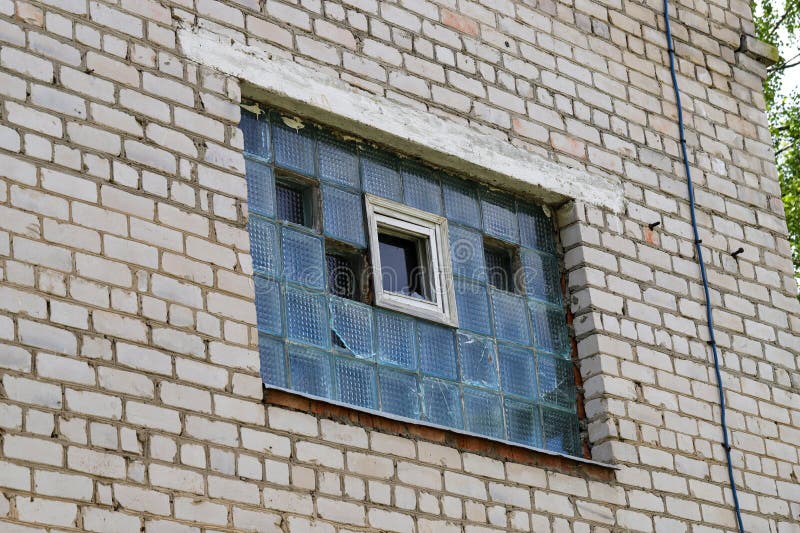 A Broken Window Made of Glass Blocks in a Brick Wall Stock Image ...