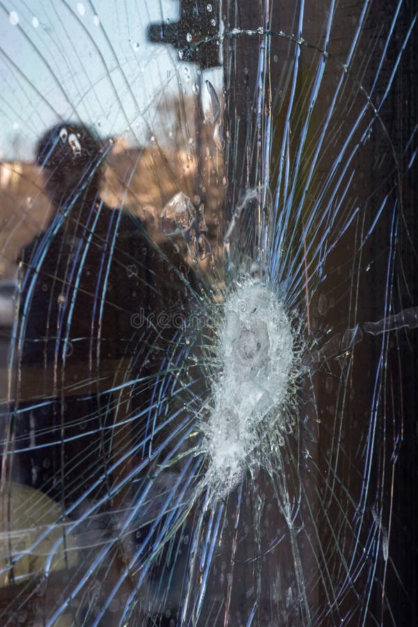 A Broken Window with a Reflection of a Person Stock Image - Image of ...