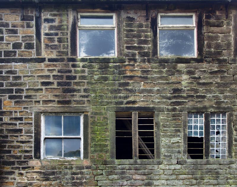 Broken Windows in an Empty Abandoned Vandalised Old Stone Building ...