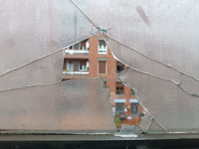 Broken Windows with View of Houses through it Stock Photo - Image of ...