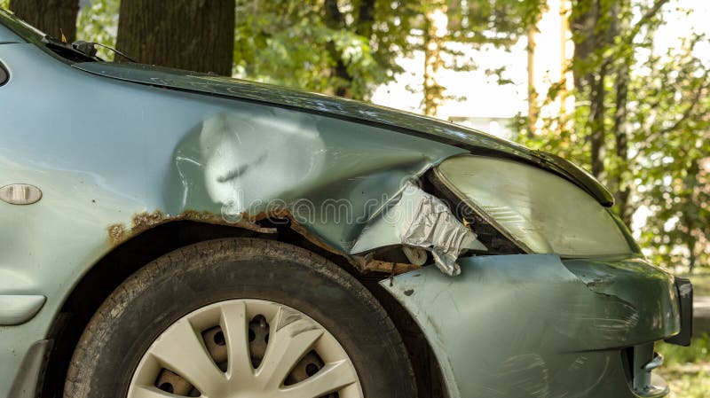 The Broken Wing of a Green Car Stock Image - Image of speeding, broken ...