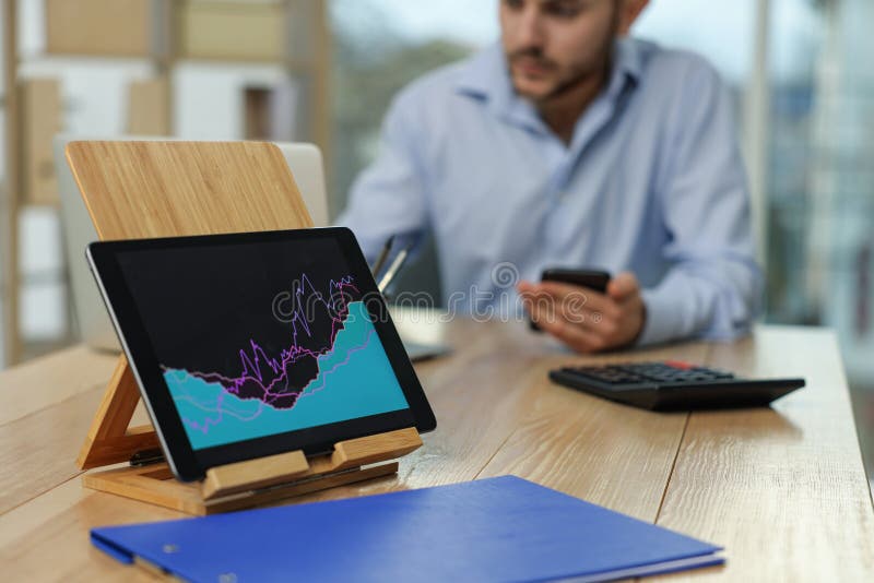 Broker Working in Office, Focus on Tablet with Chart. Forex Trading ...