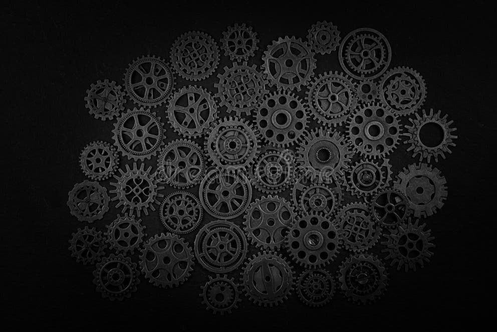 Bronze Cogs and Wheels Arranged on Slate Rock Background Showing ...