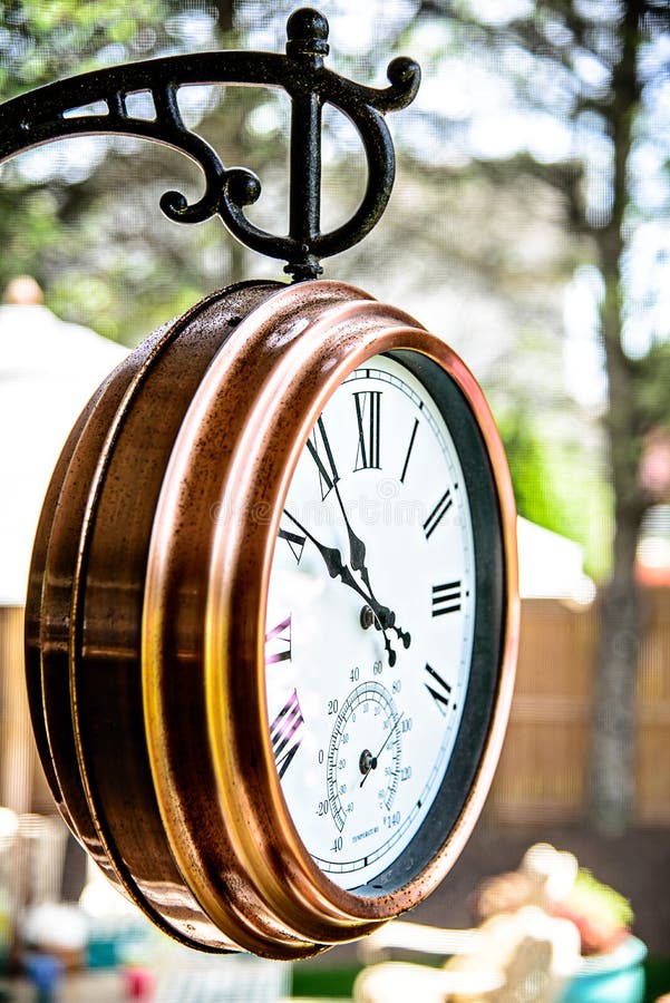 Bronze Copper Outdoor Clock Stock Image - Image of clock, hanging: 54733883