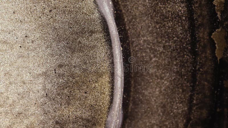 Bronze Dust Particles Fly in Slow Motion in the Air Lingering Slowly ... Bronze Dust Particles Fly in Slow Motion in the Air Lingering Slowly ...