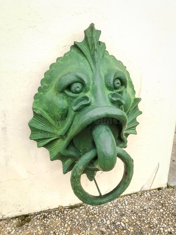 Bronze head fish sculpture stock image. Image of mooring - 239438363