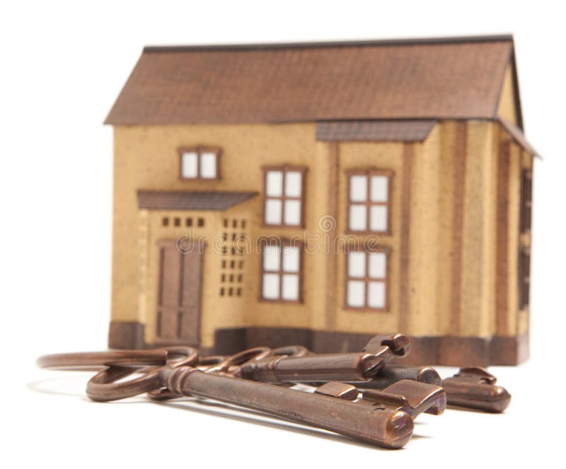 Bronze key and house model stock photo. Image of mortgage - 29726740
