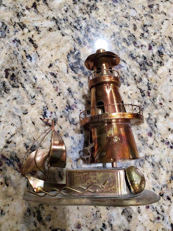 Bronze Lighthouse Music Box Stock Photo - Image of wheel, tire: 209780582